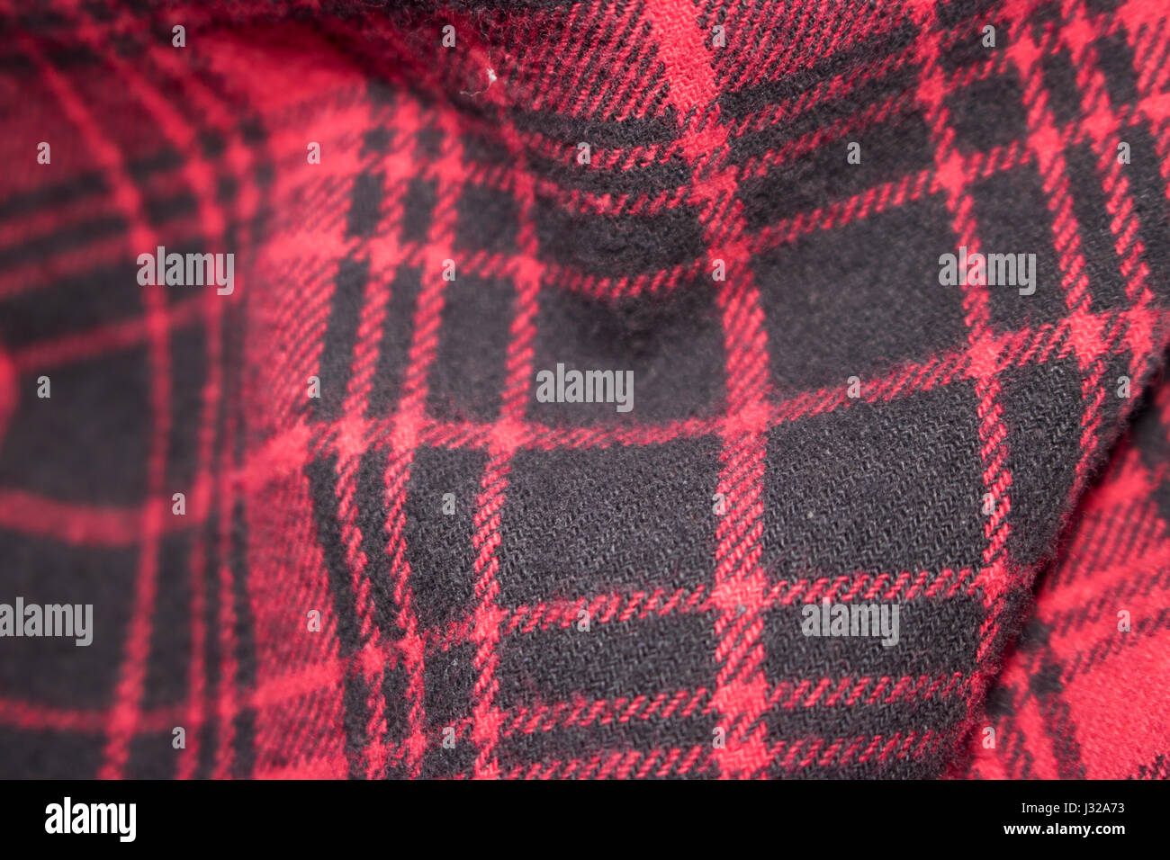 Red plaid flannel fabric cloth tartan garment textile Stock Photo - Alamy
