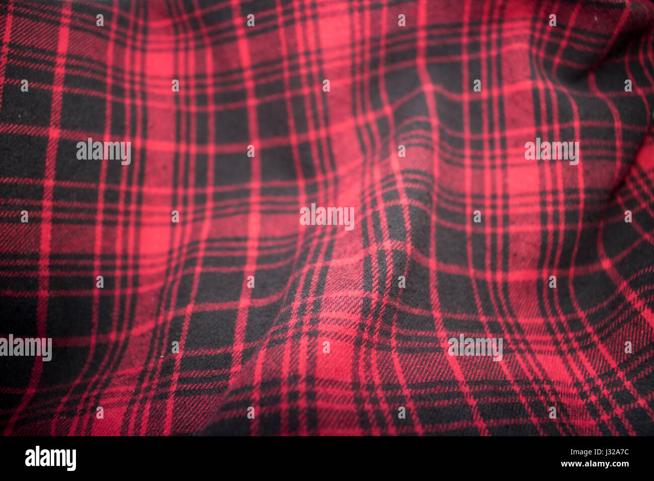 Red plaid flannel fabric cloth tartan garment textile Stock Photo - Alamy