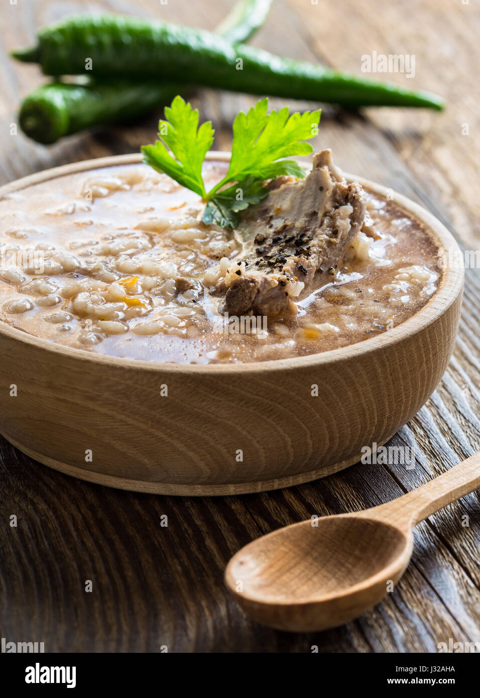 Pork ribs soup with rice in wooden bowl Stock Photo - Alamy