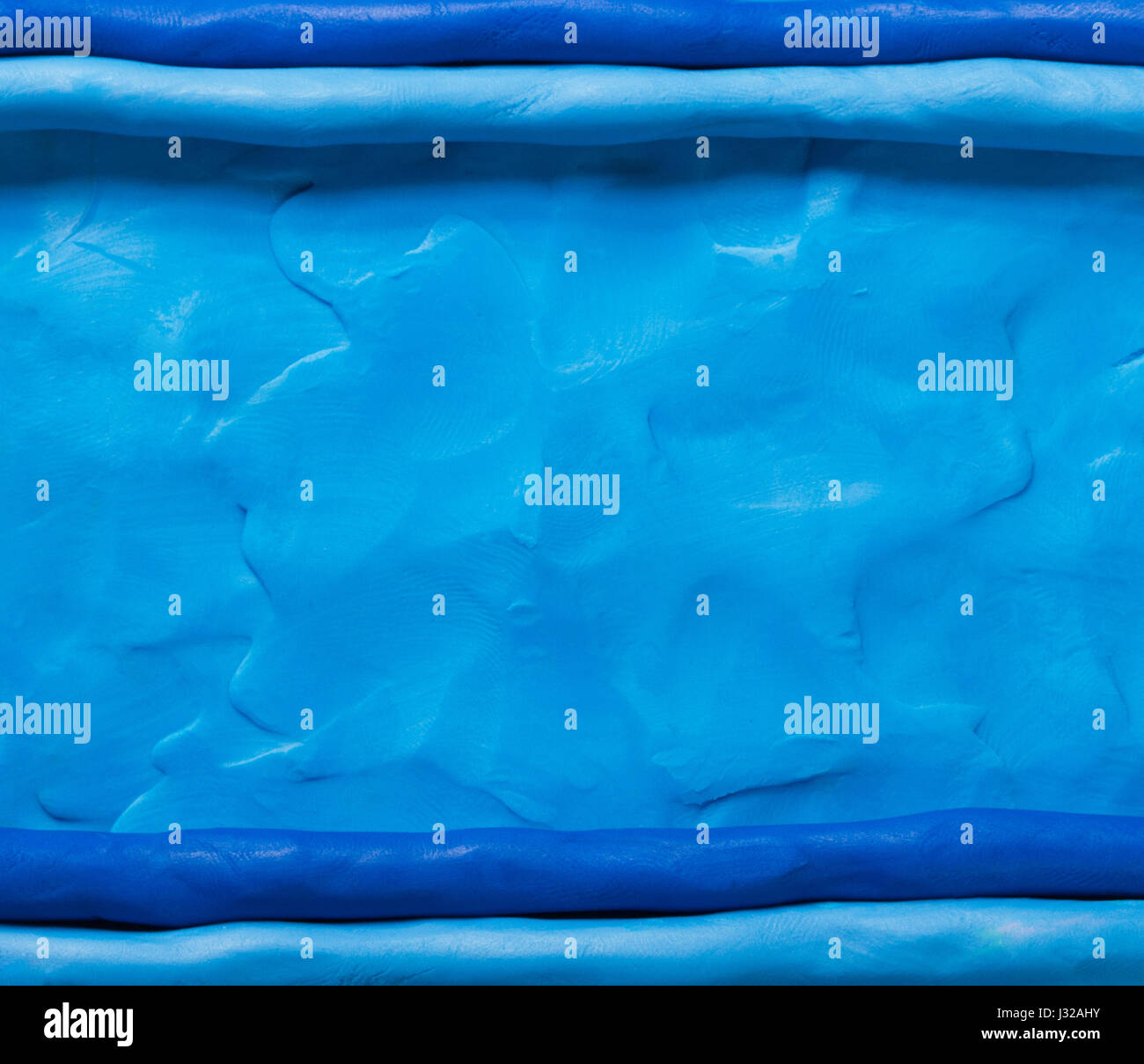 Blue plasticine textured background Stock Photo - Alamy