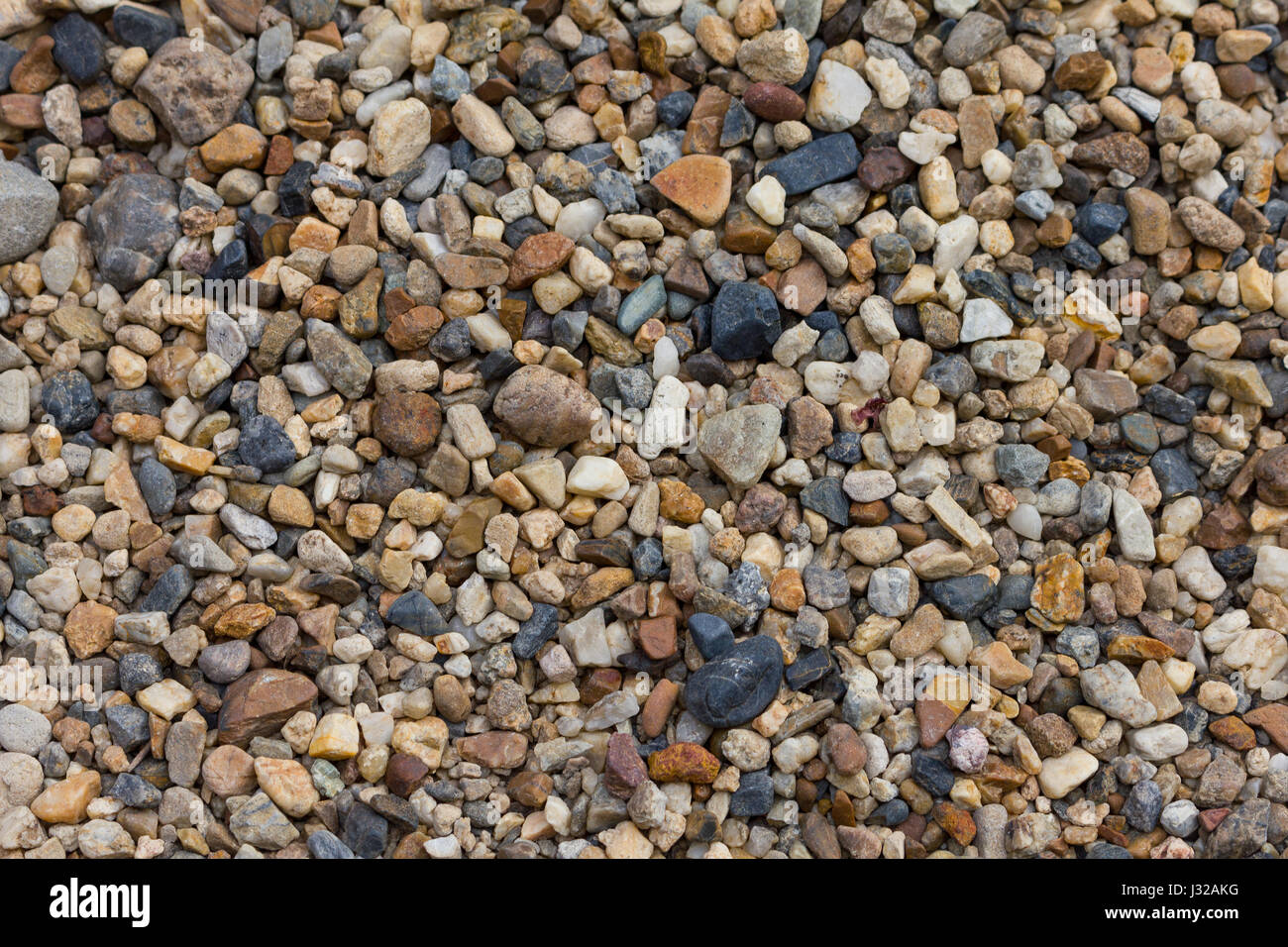 Small pebbles rock background Stock Photo - Alamy