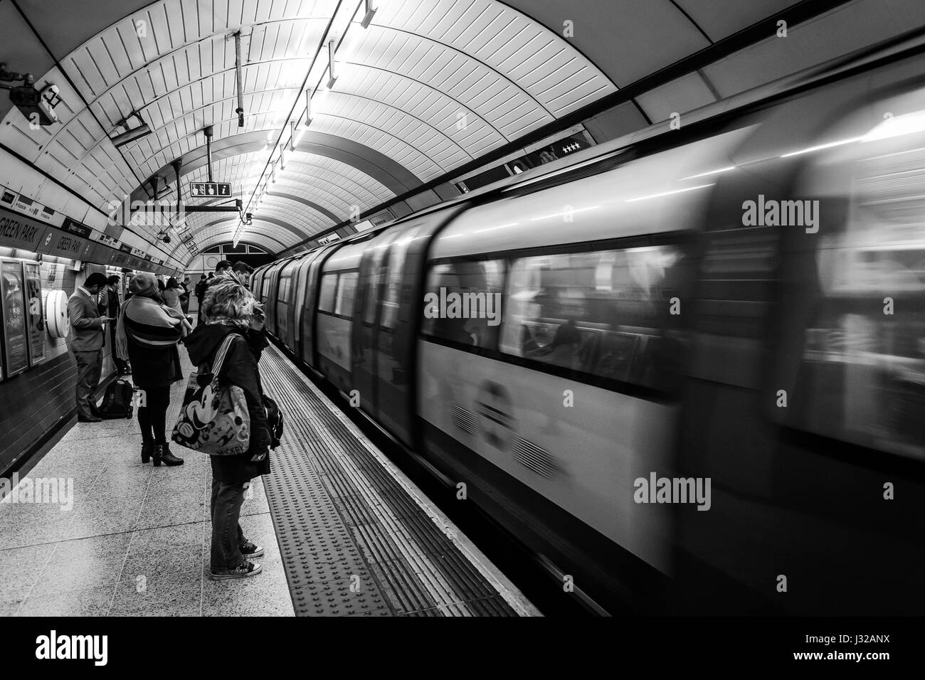 Commuters on London Tube Stock Photo - Alamy