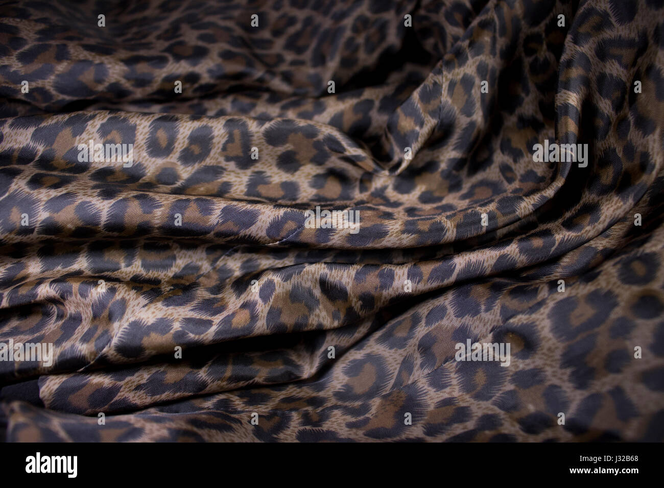 shiny leopard fabric cloth garment textile industry Stock Photo - Alamy