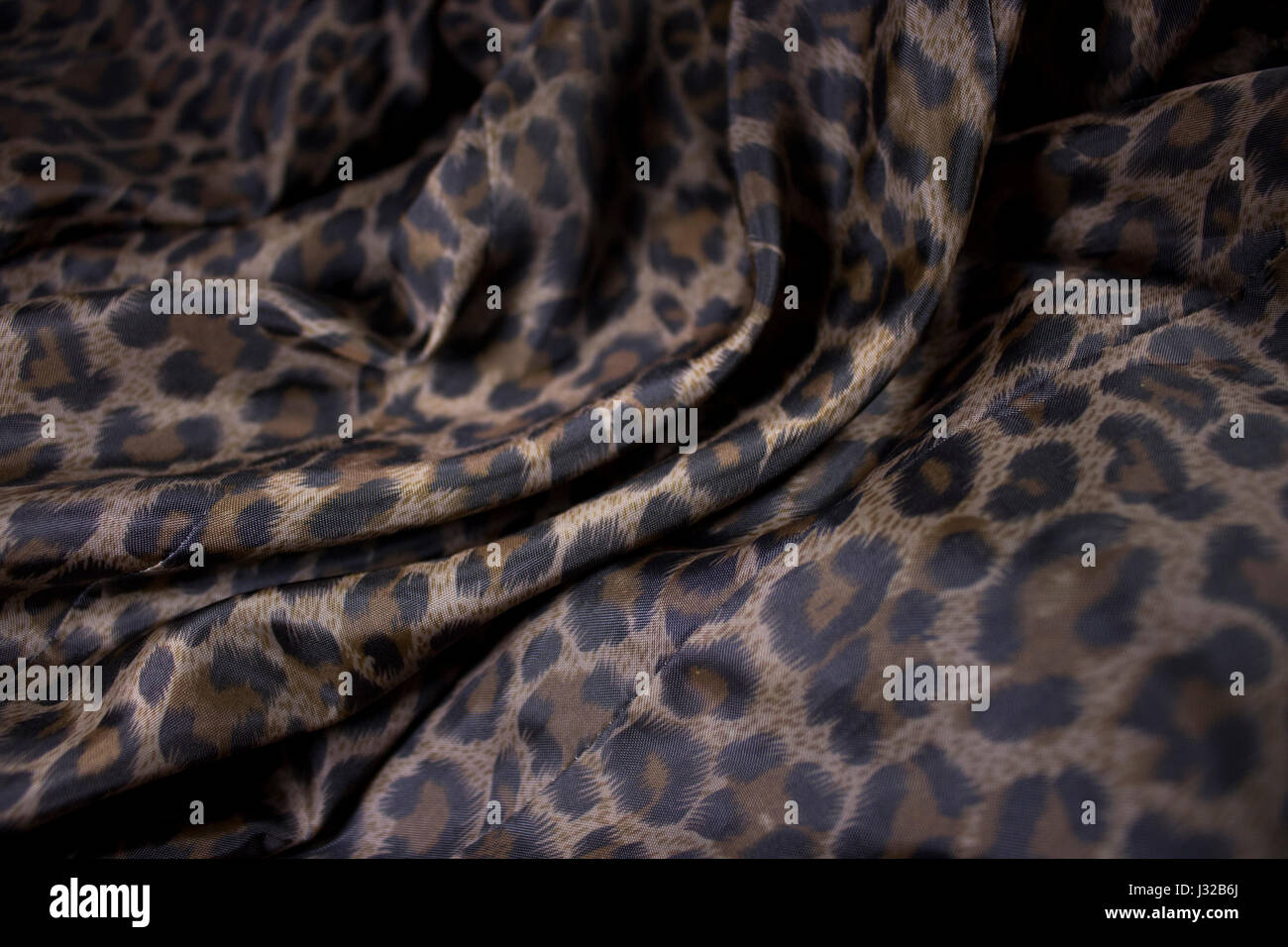 shiny leopard fabric cloth garment textile industry Stock Photo - Alamy