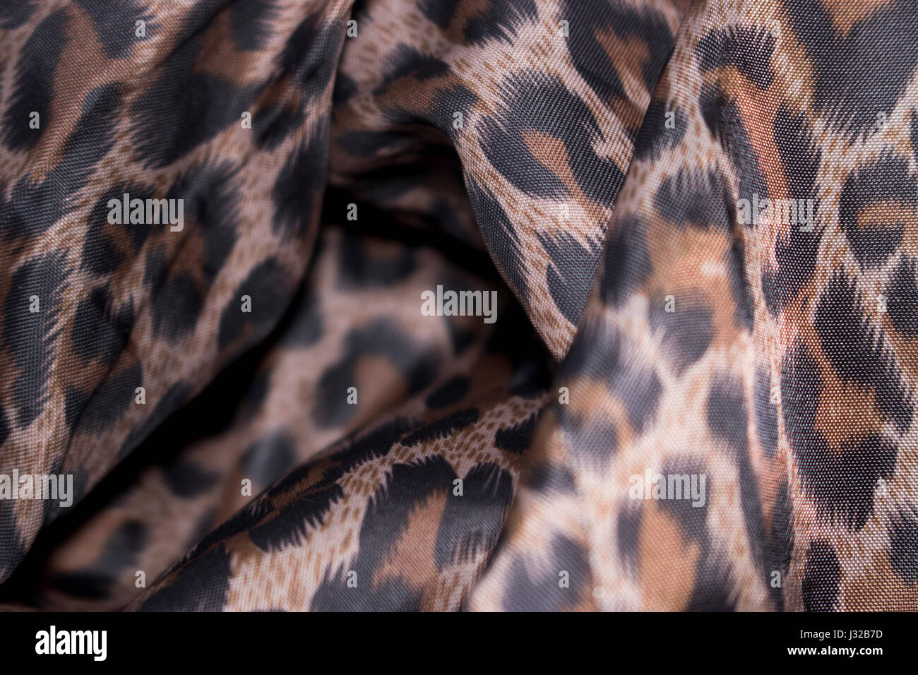 shiny leopard fabric cloth garment textile industry Stock Photo - Alamy