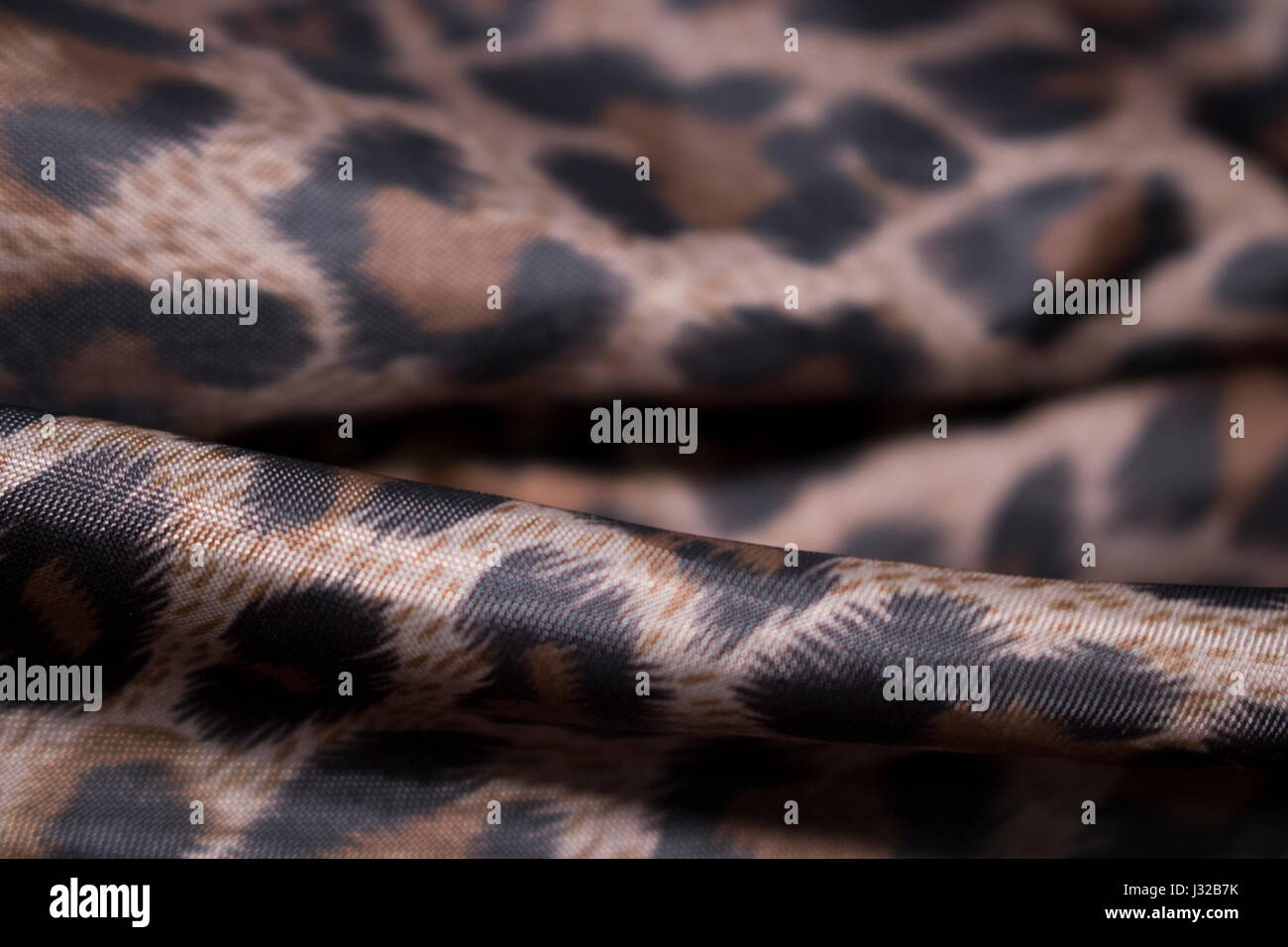 shiny leopard fabric cloth garment textile industry Stock Photo - Alamy