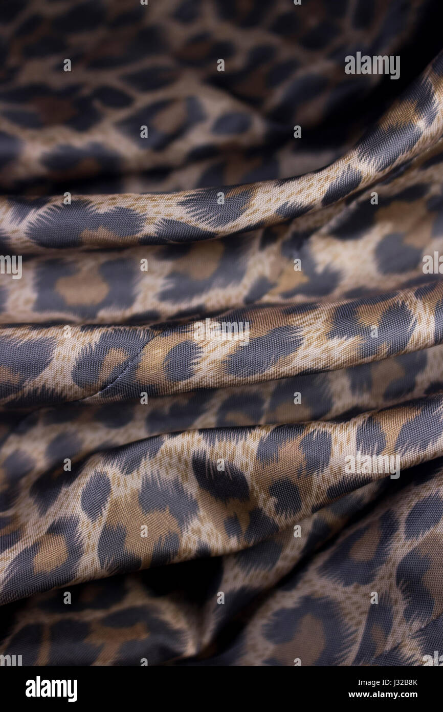 shiny leopard fabric cloth garment textile industry Stock Photo - Alamy