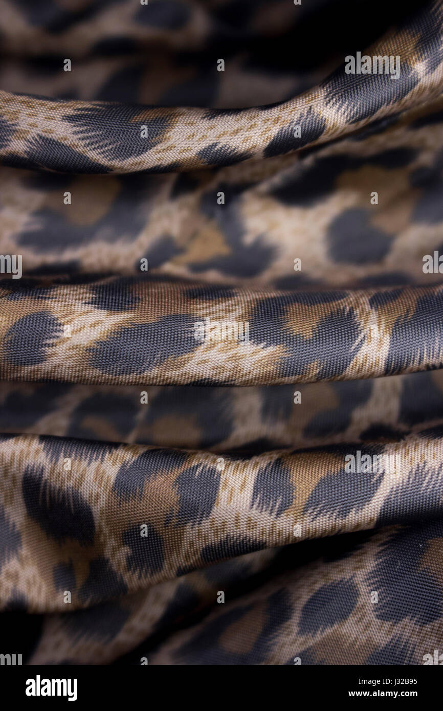 shiny leopard fabric cloth garment textile industry Stock Photo - Alamy