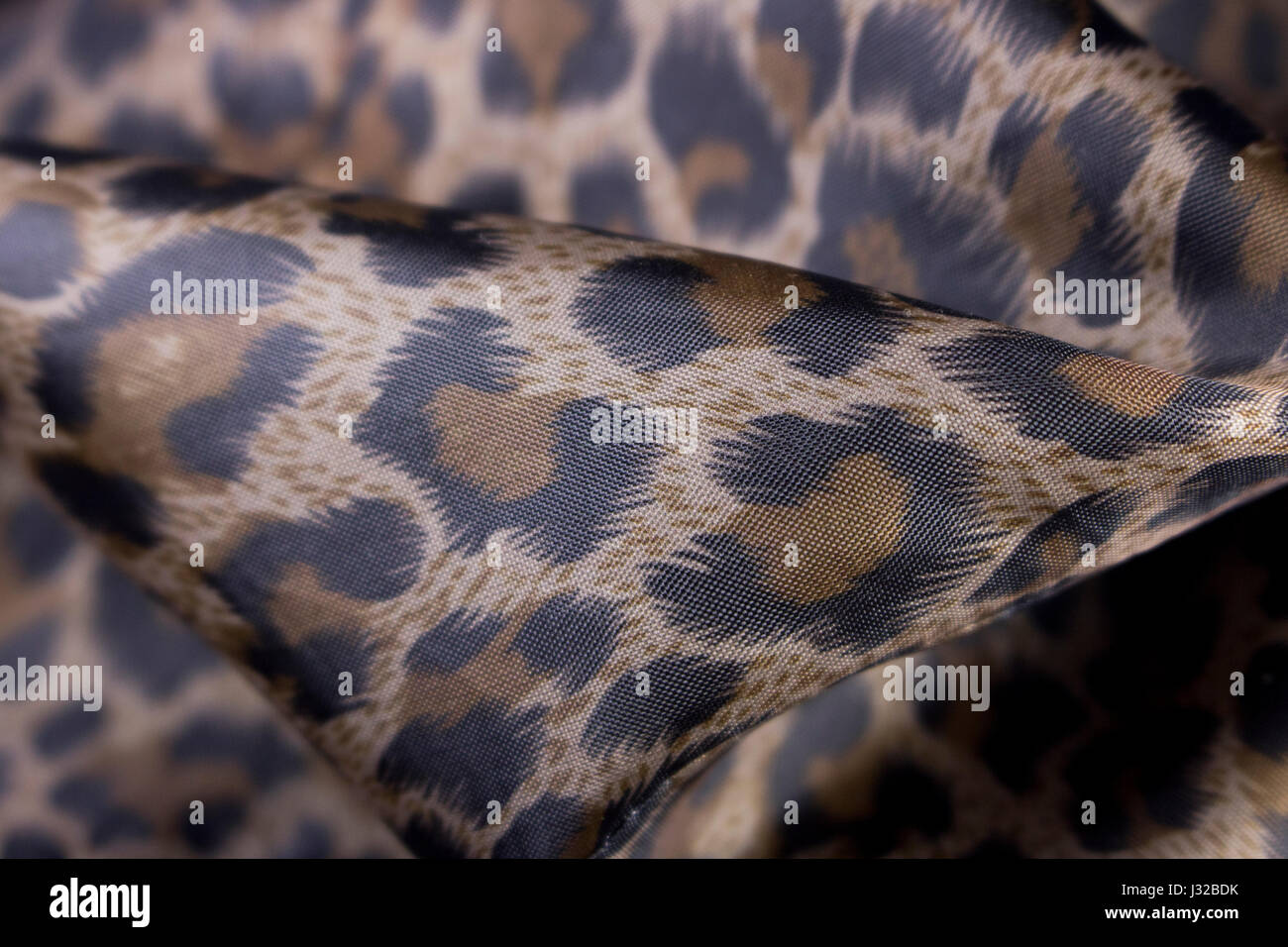 shiny leopard fabric cloth garment textile industry Stock Photo - Alamy
