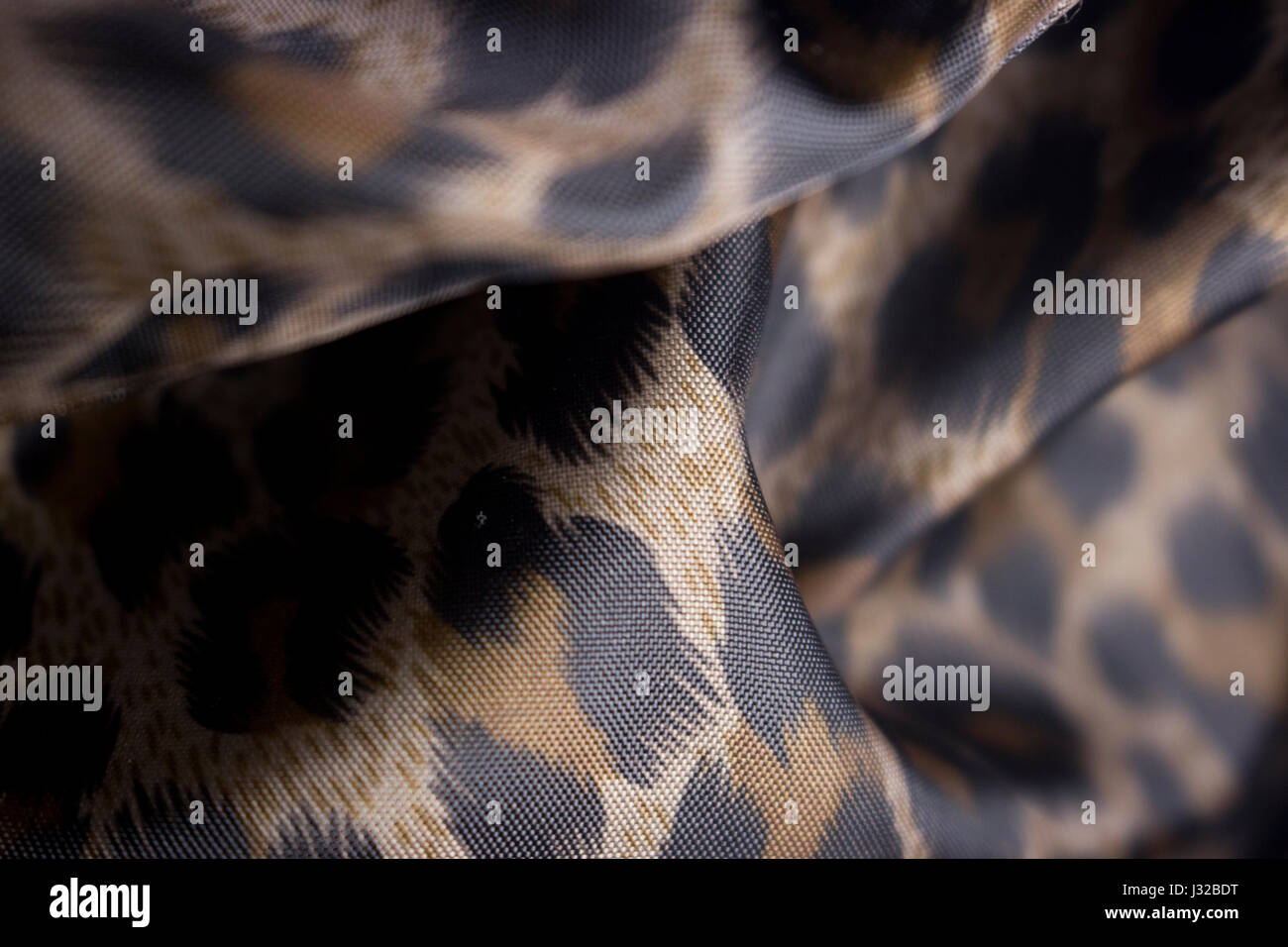 shiny leopard fabric cloth garment textile industry Stock Photo - Alamy