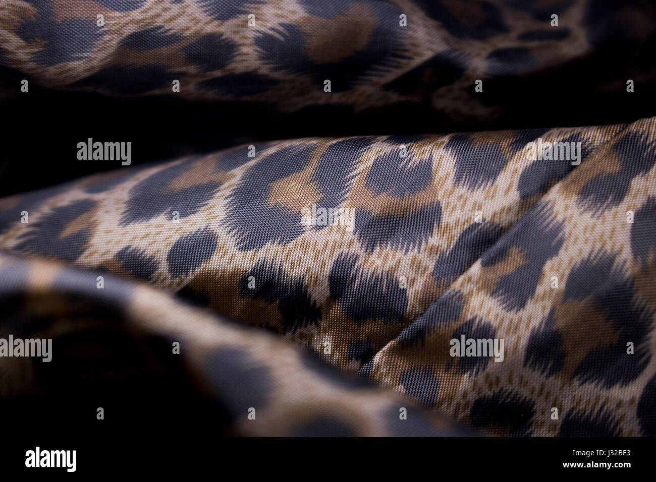 shiny leopard fabric cloth garment textile industry Stock Photo - Alamy