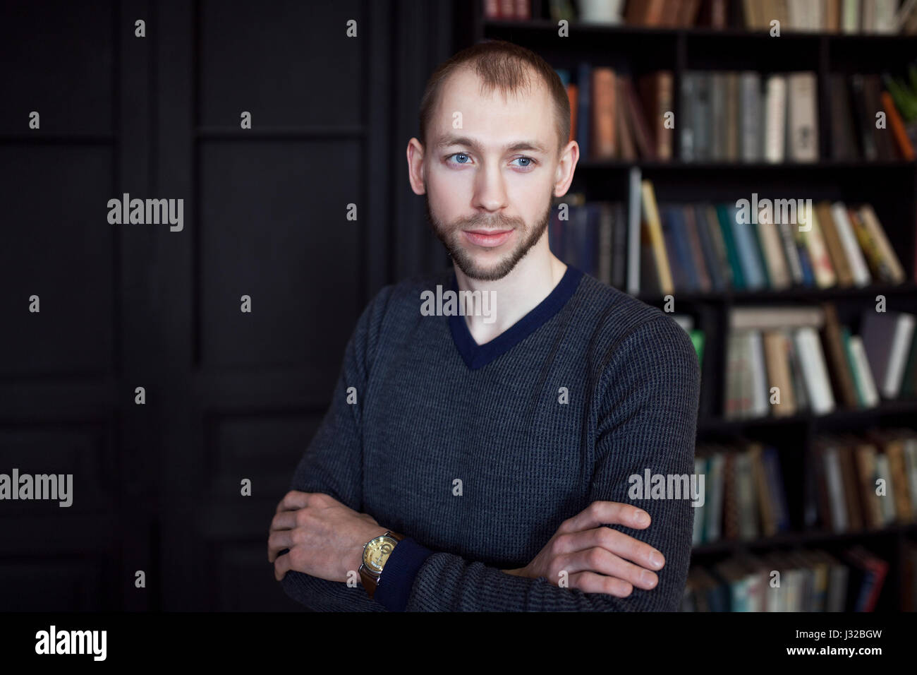 Young caucasian man thinking library hi-res stock photography and ...