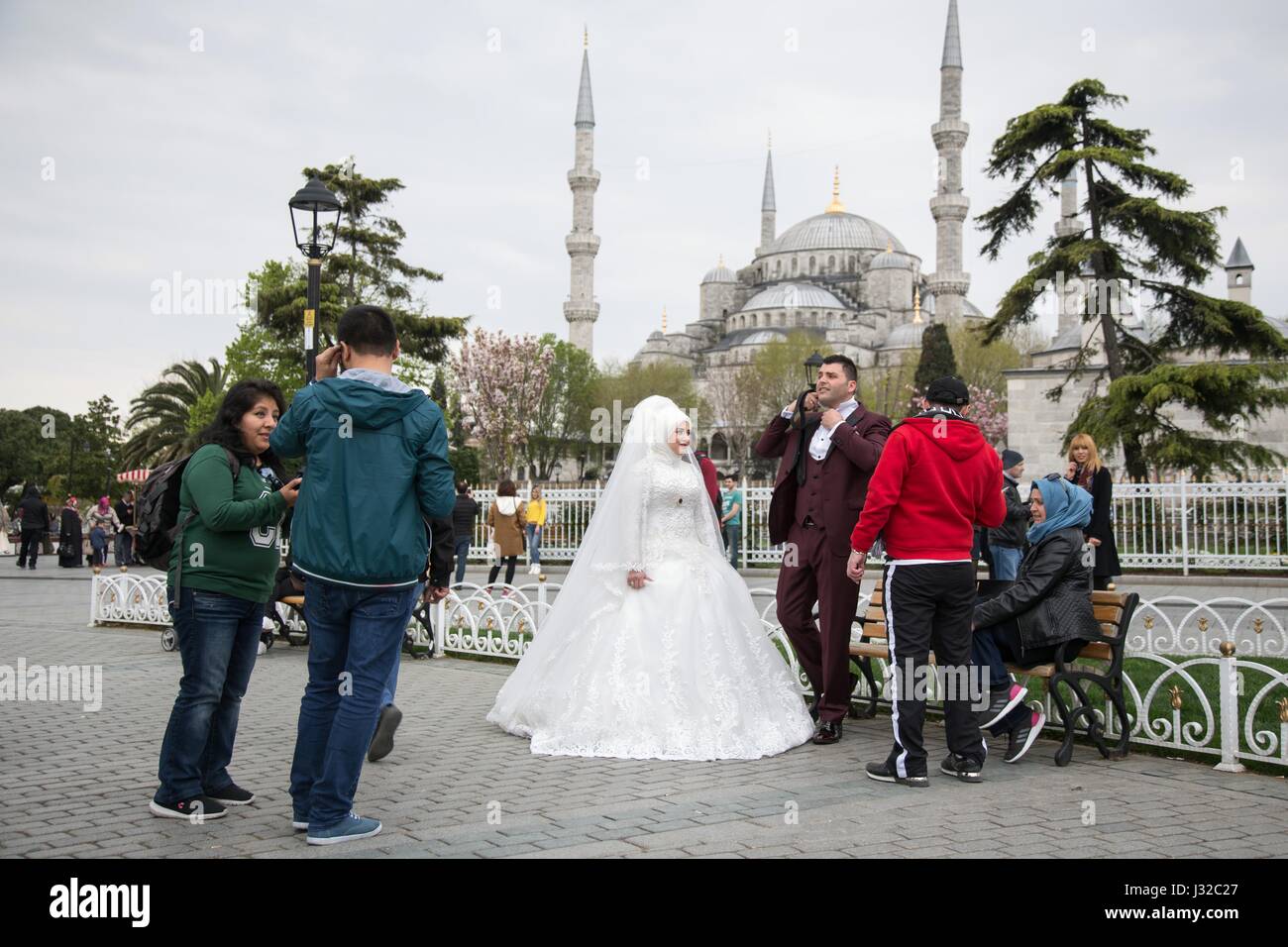 A couple to be wed stand outside the Blue Mosque, Sultan Ahmed Mosque ...