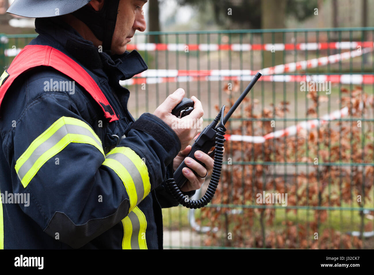 German firefighter leader used a walkie talkie in action Stock Photo ...