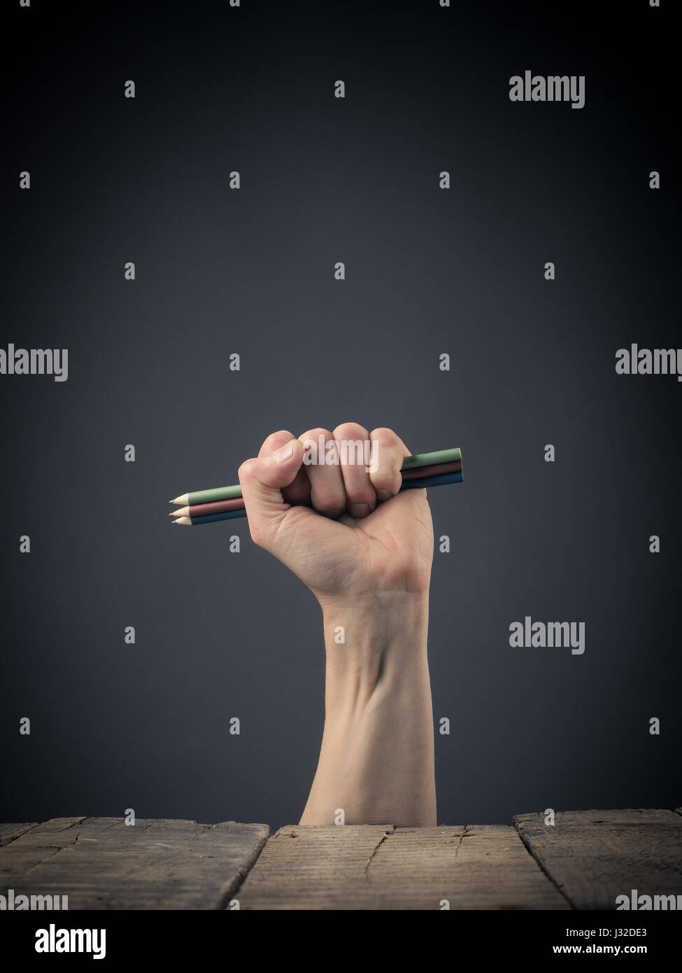 Concept image with hand holding pencils, art or creativity concept ...