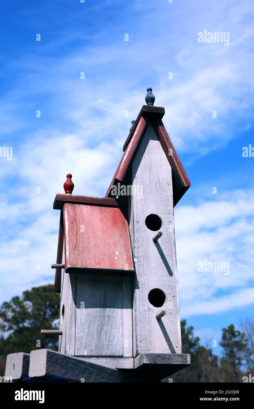 Russian Orthodox influenced birdhouse is composed of rough hewn wood ...