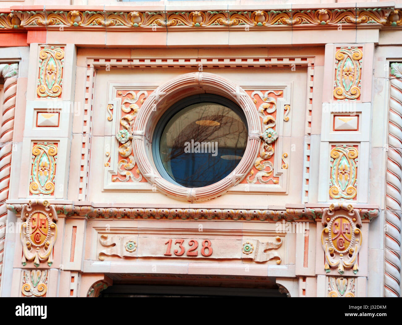 Beautiful terra cotta facade surrounds circular window on the ...