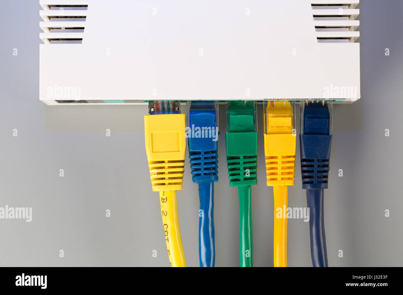 Office router connected to five multi-colored patch cord with ...