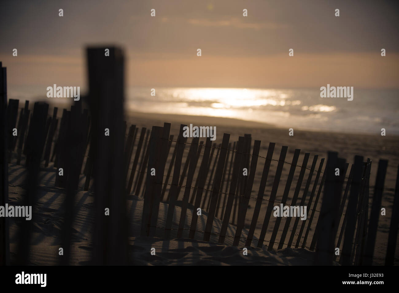 Beach Fence at Dawn Stock Photo - Alamy