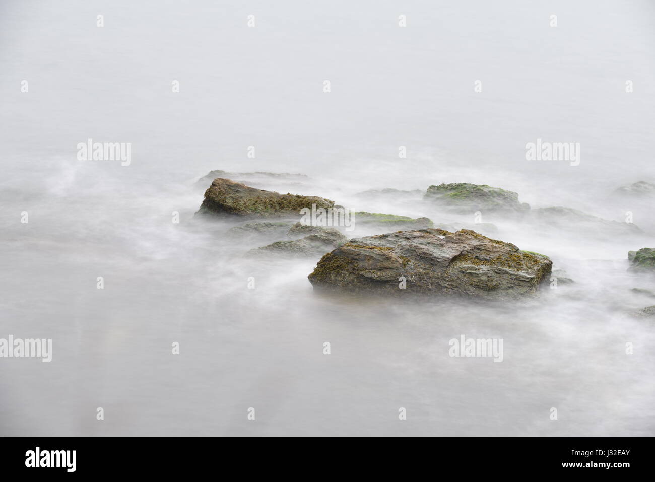 Ocean Waves Over Rocks at Cliff Walk in Rhode Island Stock Photo - Alamy