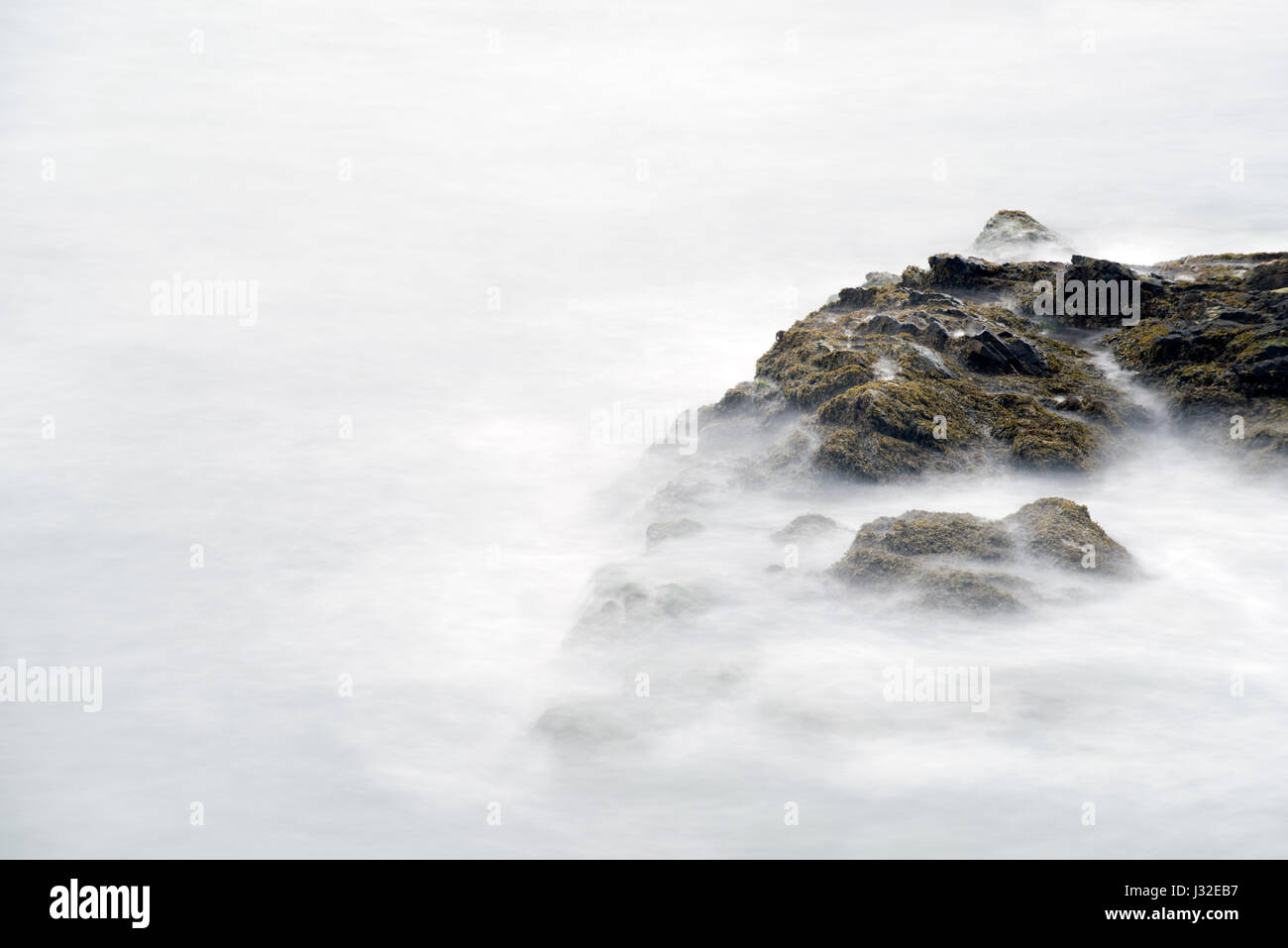 Ocean Waves Over Rocks at Cliff Walk in Rhode Island Stock Photo - Alamy