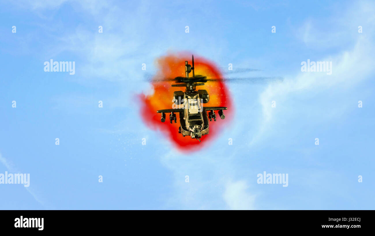 Military helicopter flying in front of explosion Stock Photo - Alamy