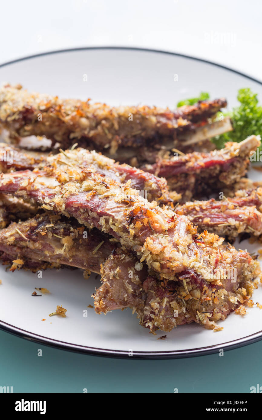 German style lamb chops on white plate Stock Photo - Alamy