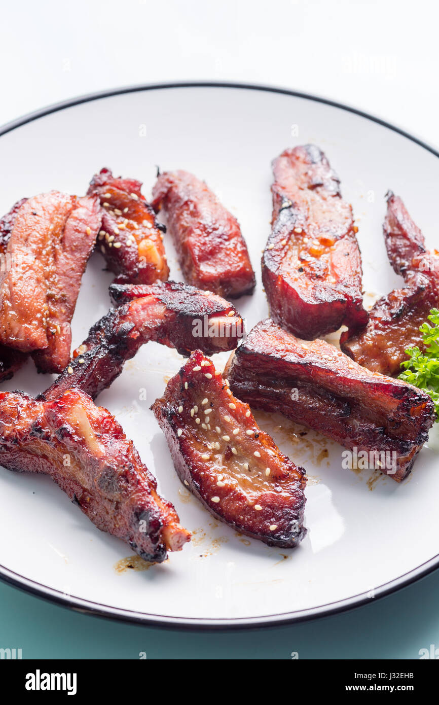German style pork ribs on white plate Stock Photo - Alamy