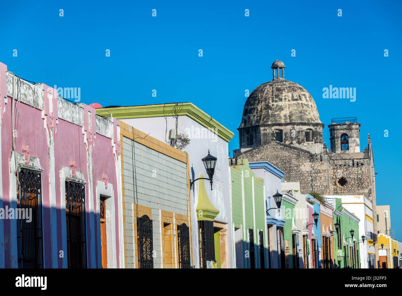 Colorful colonial street in Campeche, Mexico with the Ex Temple of San ...