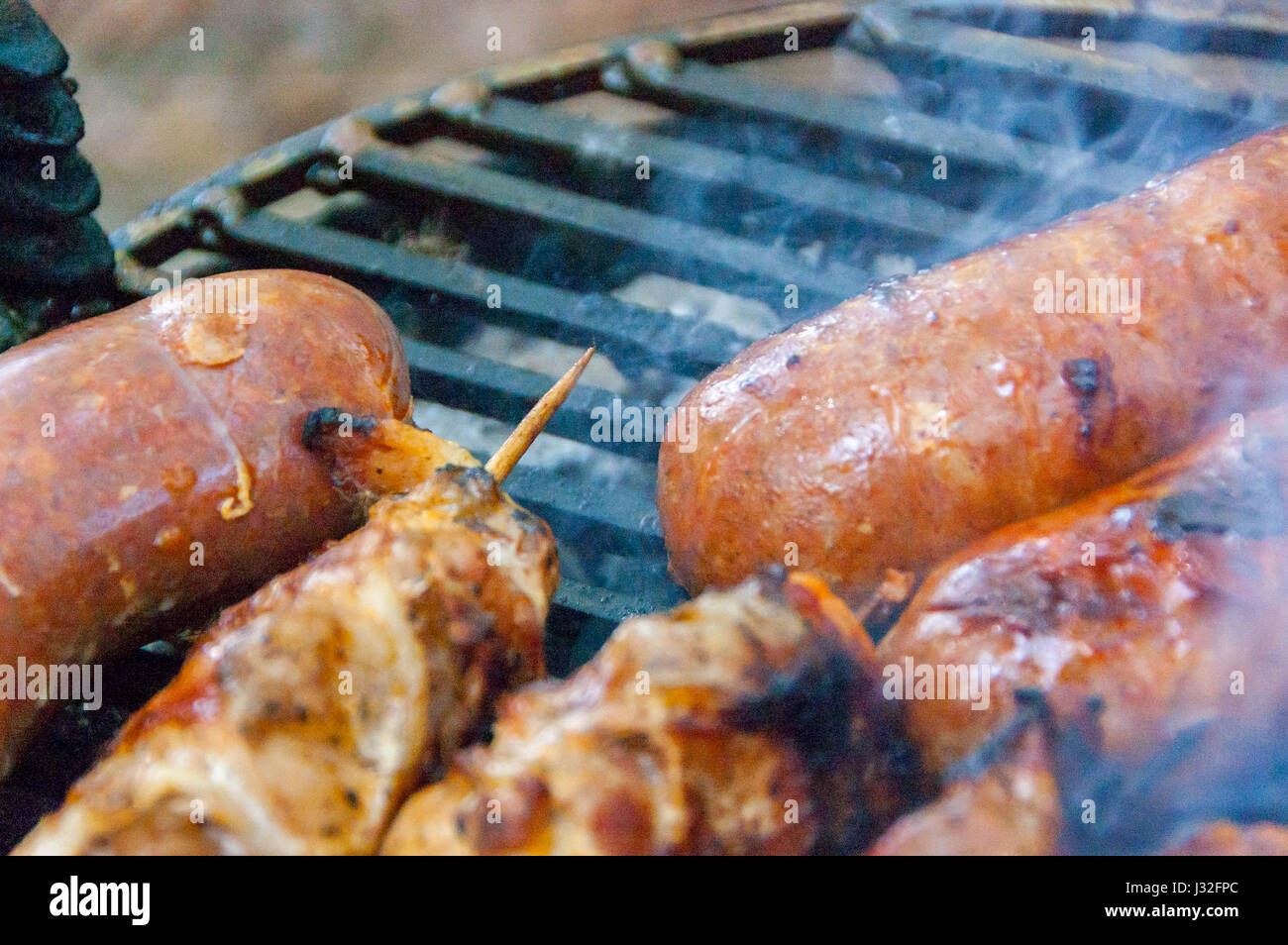 Barbecue grill with meat, sausage and Shashlik or Shish kebab Stock ...