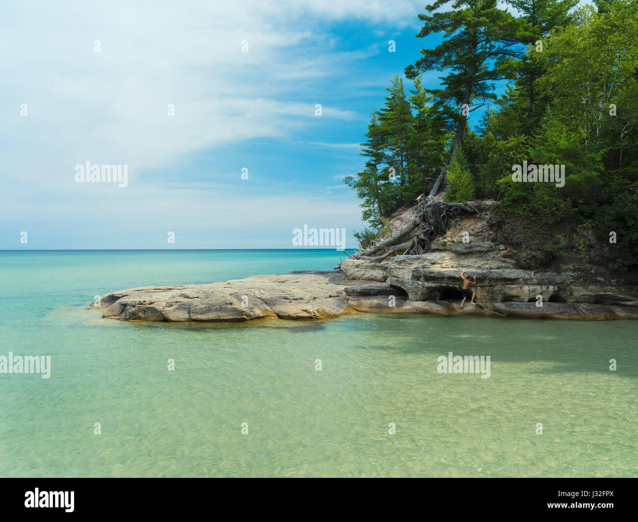 A boy climbs on the rocks. Image from the area known as "The Cove ...