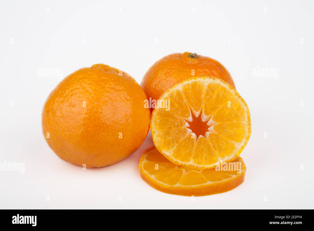 Whole and sliced clementine fruits isolated in white background Stock ...