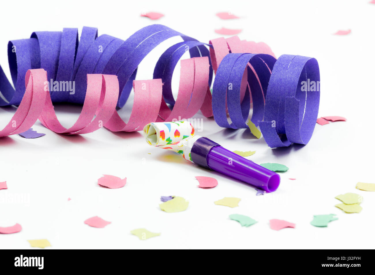 confetti, streamers and party blower on white background Stock Photo ...