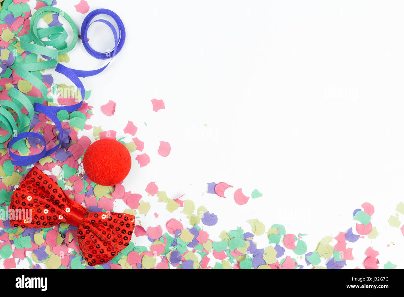 confetti, streamers and red bow on white background Stock Photo - Alamy