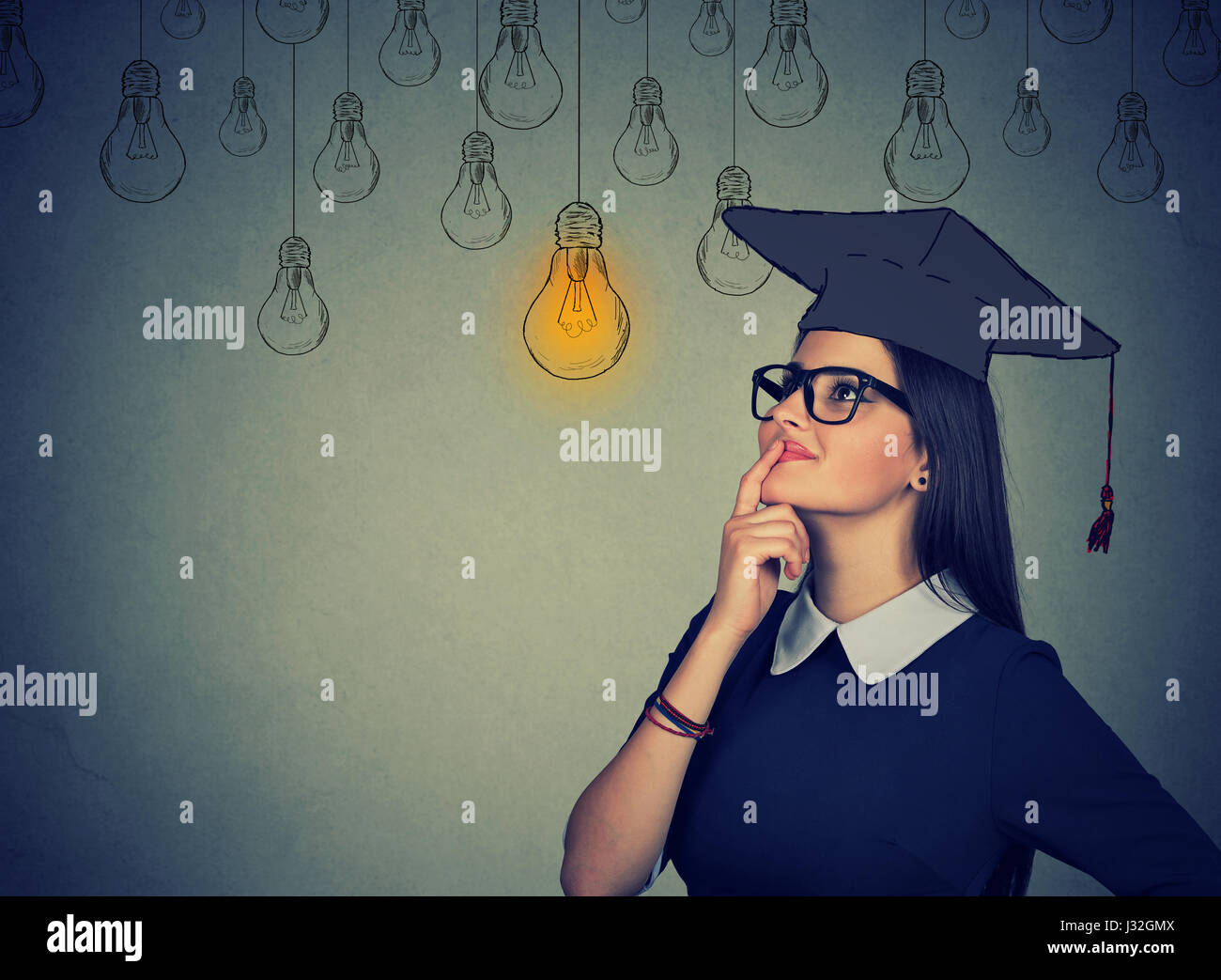 Closeup portrait beautiful thoughtful graduate student girl young woman ...