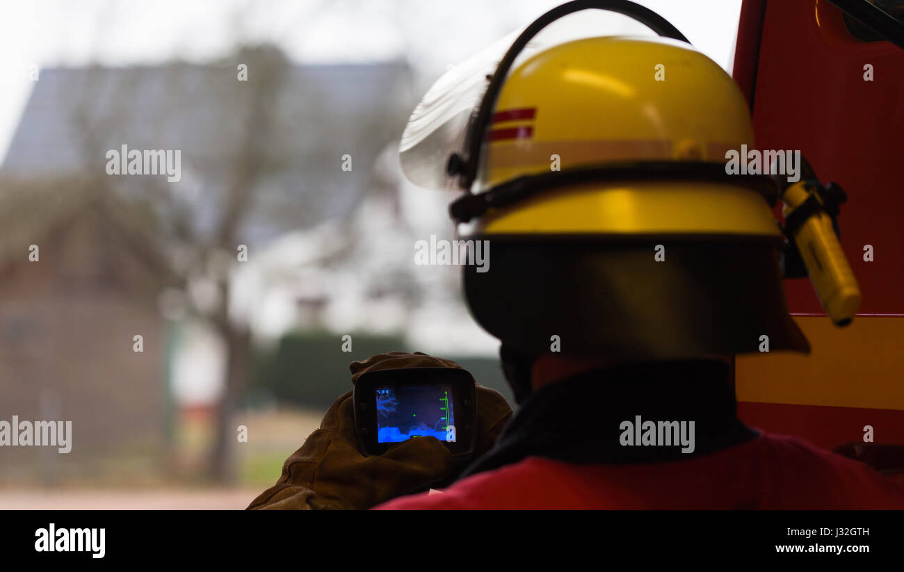 German firefighter in a action with a thermal imaging camera Stock ...