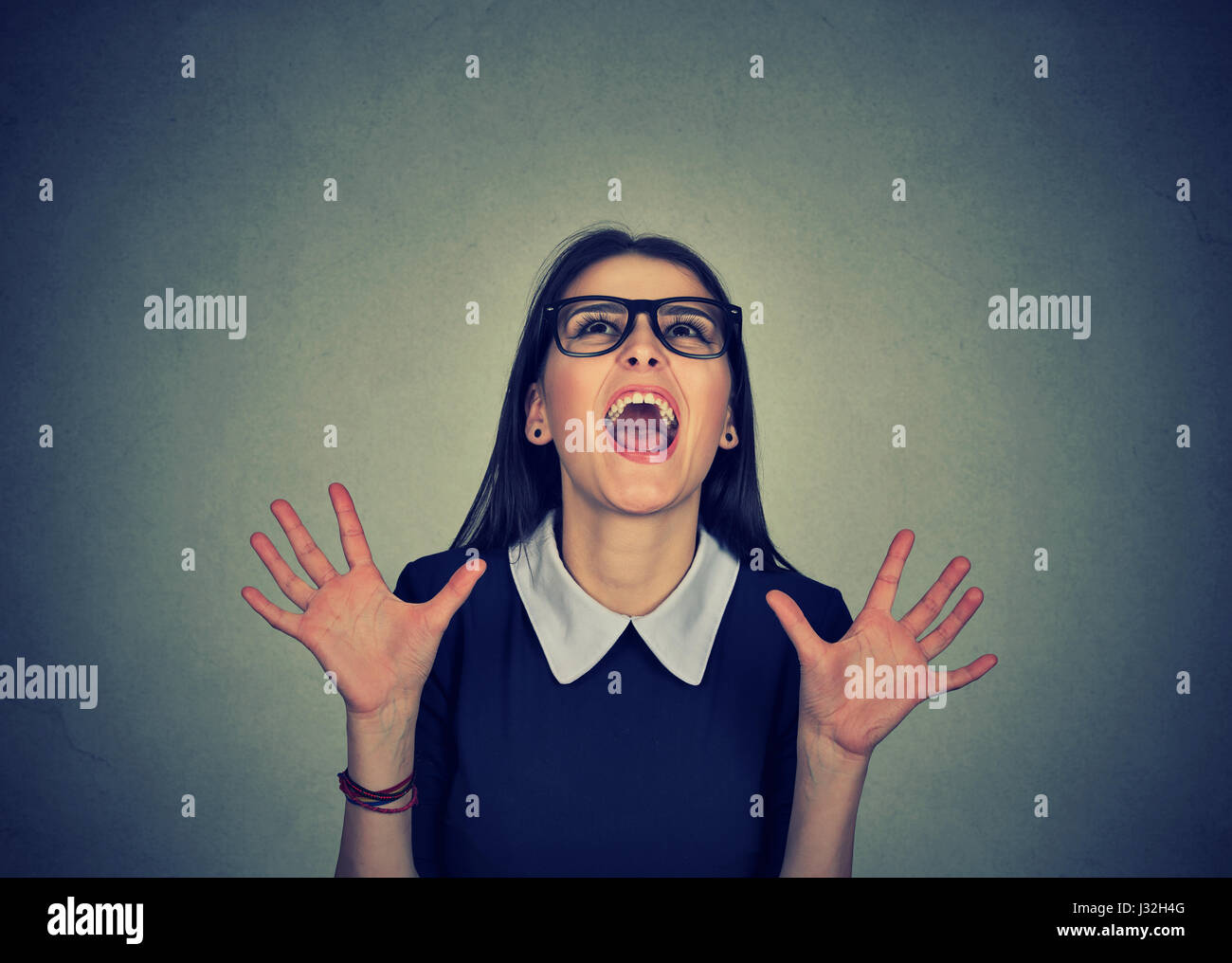 happy super excited woman isolated on gray background Stock Photo - Alamy
