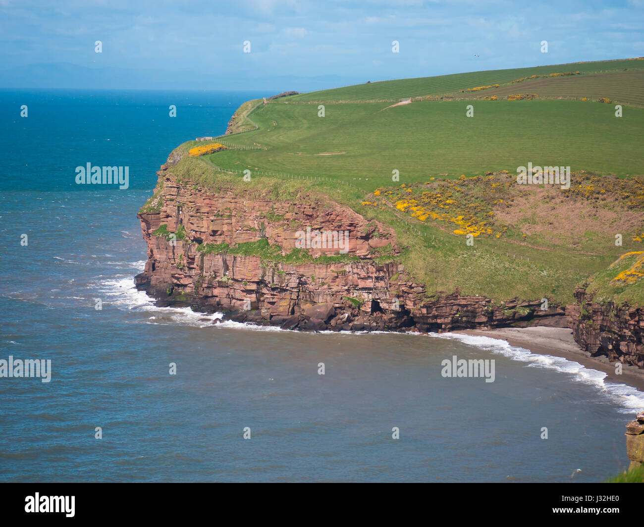 The cliff face and coast to coast path at St Bees head and Fleswick bay ...