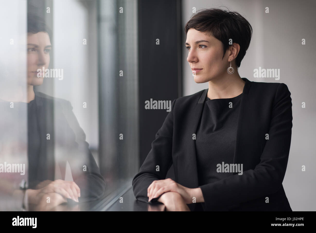Portrait Of Successful Businesswoman by the window Entrepreneur At Busy ...