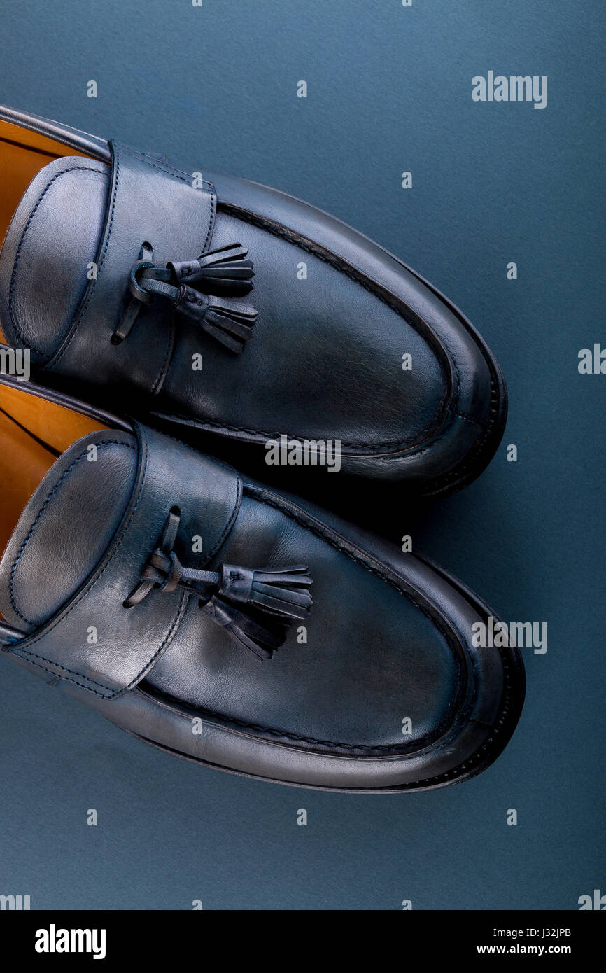 Blue loafer shoes on blue background. One pair. Top view Stock Photo ...