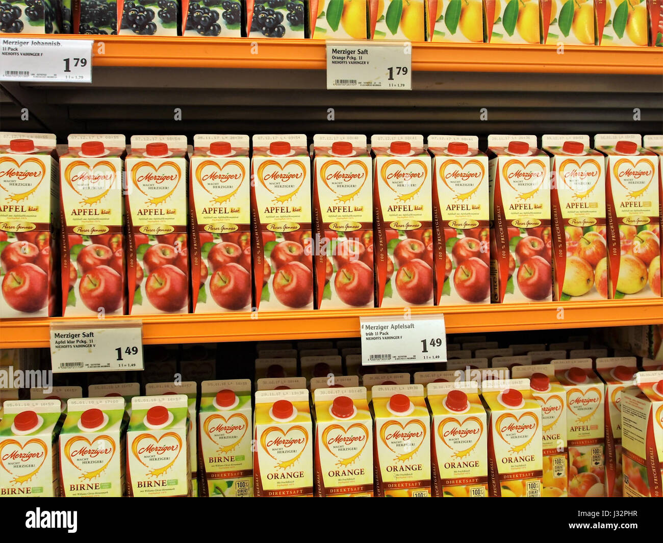 The image captures a display of fruit juices at Globus Saarbrücken, a ...