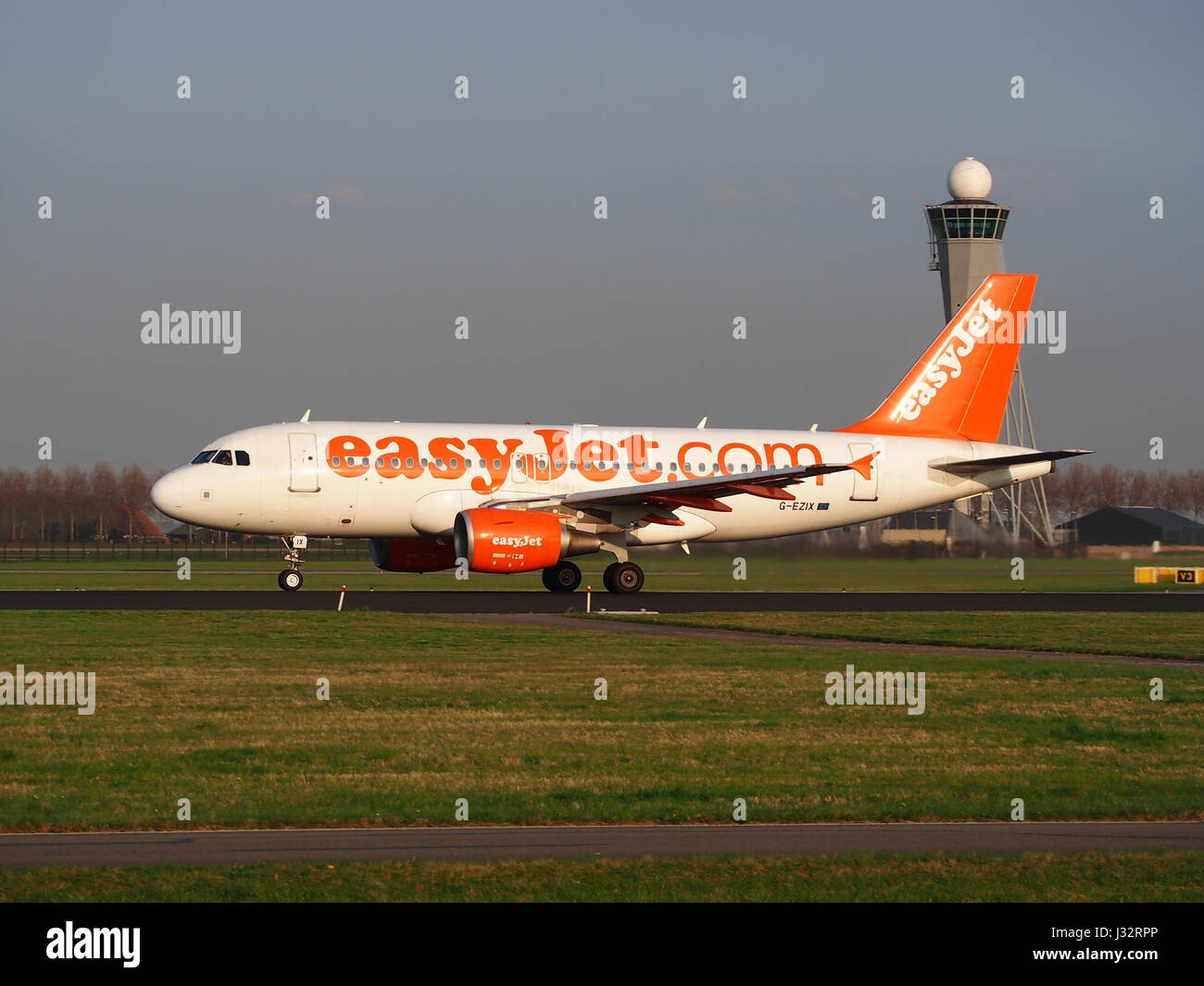 The image shows the easyJet Airbus A319-111, registration G-EZIX, at ...