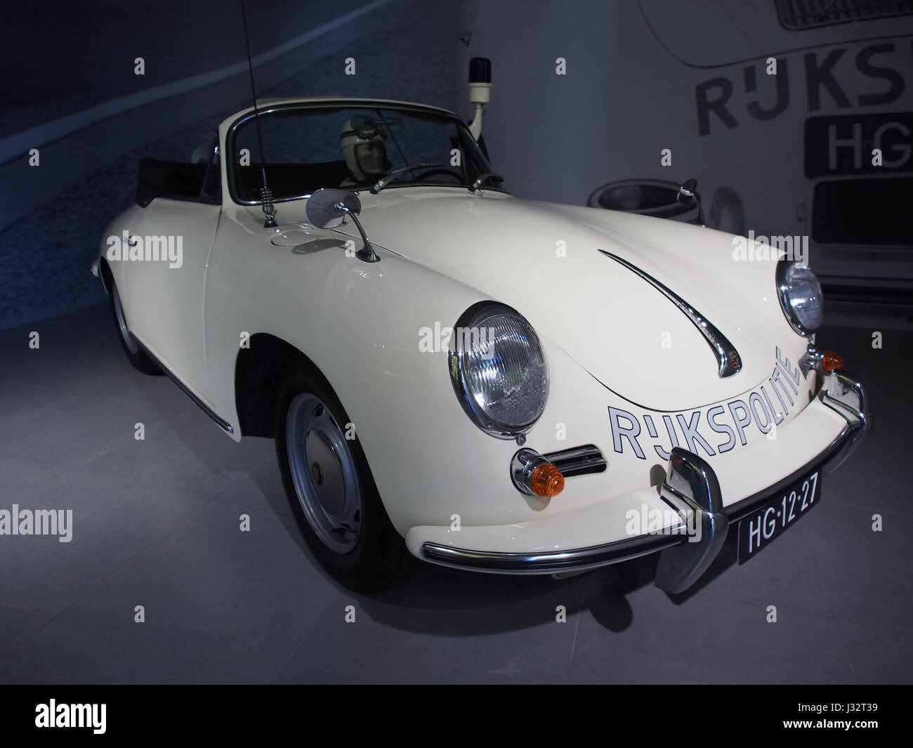 This image features a classic Porsche used by the Oude Rijkspolitie ...