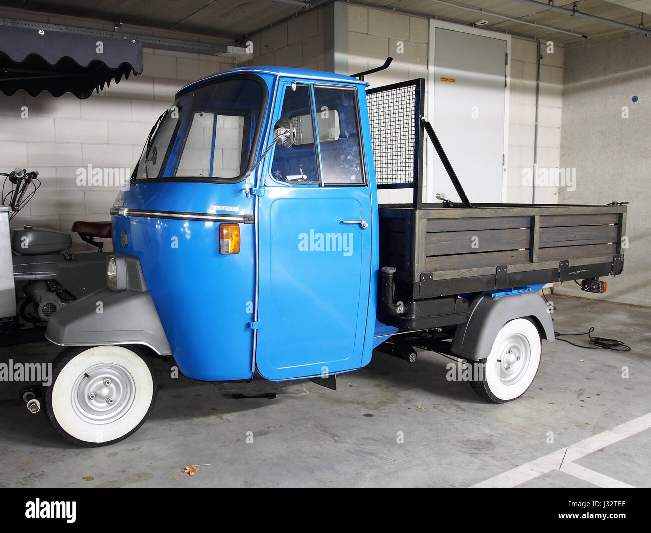 The Piaggio APE P501 is a three-wheeled vehicle, commonly used in Italy ...