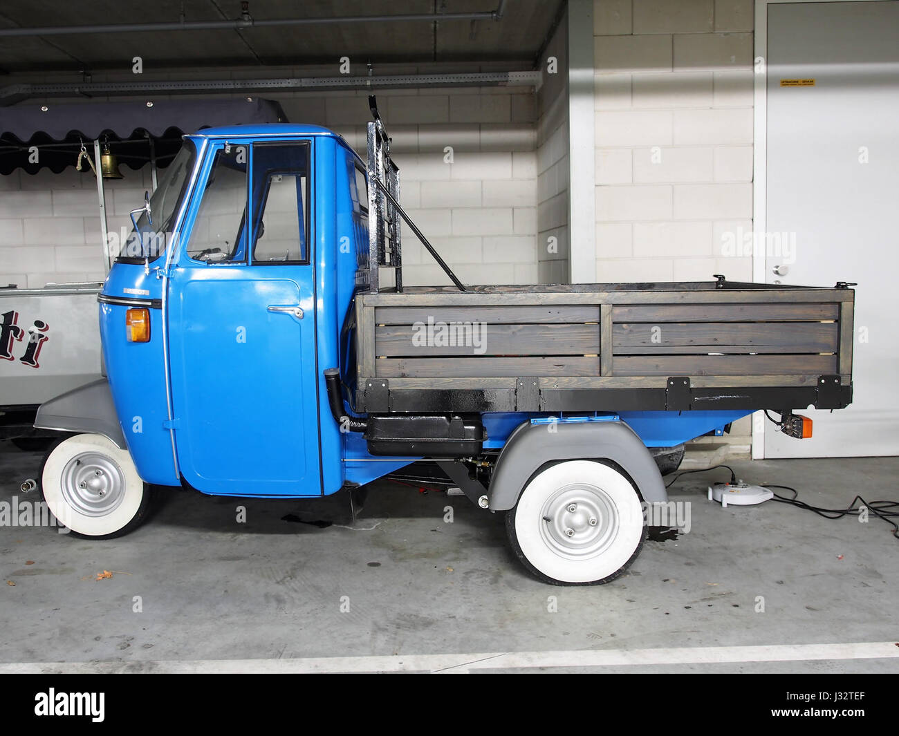 A Piaggio APE P501, a small Italian three-wheeled commercial vehicle ...