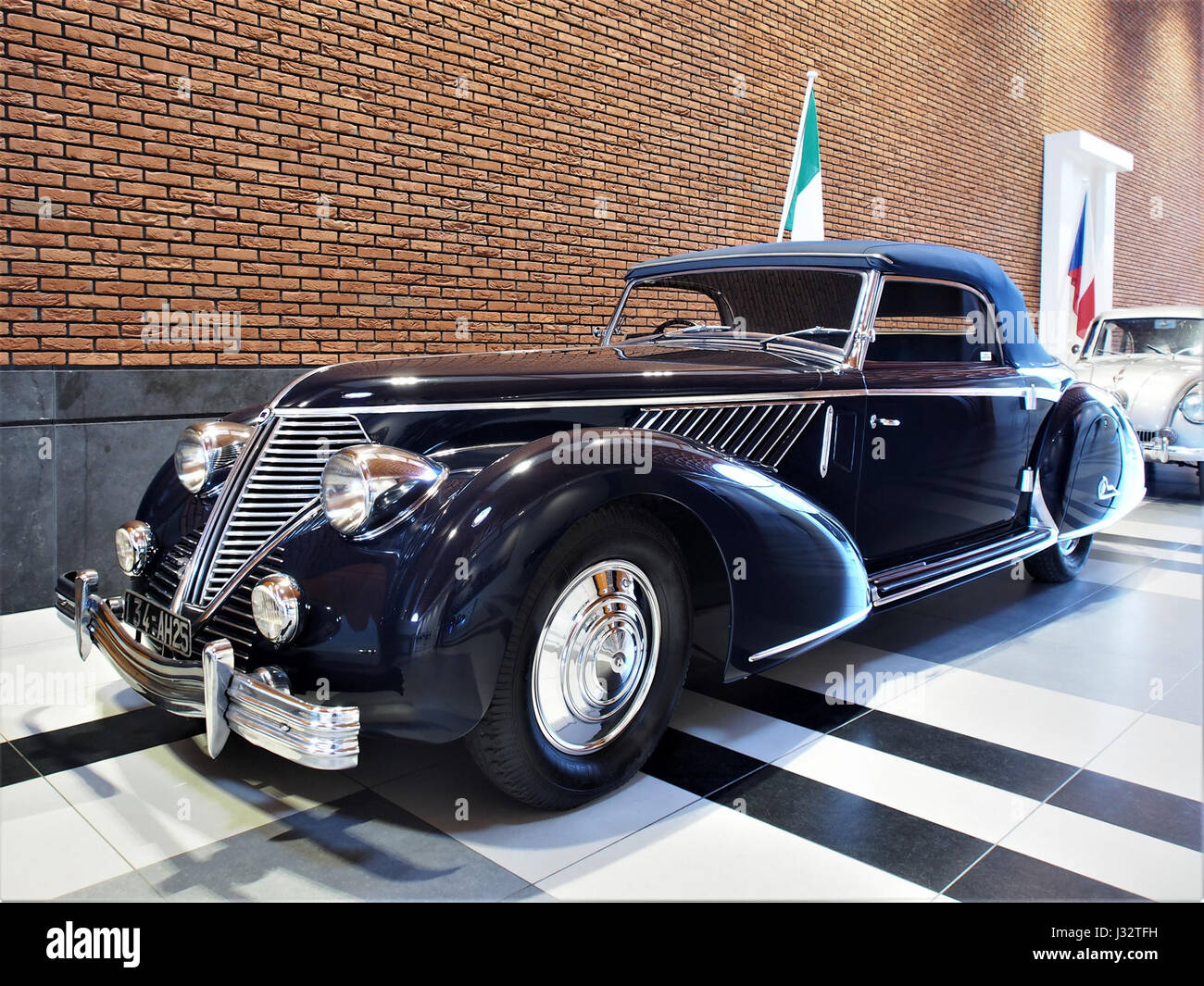 A 1938 Lancia Astura, designed by Pinin Farina, is a luxury automobile ...