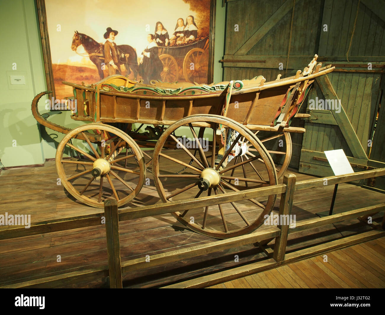 This historical photograph from 1884 shows a Dutch farmer’s wagon, an ...