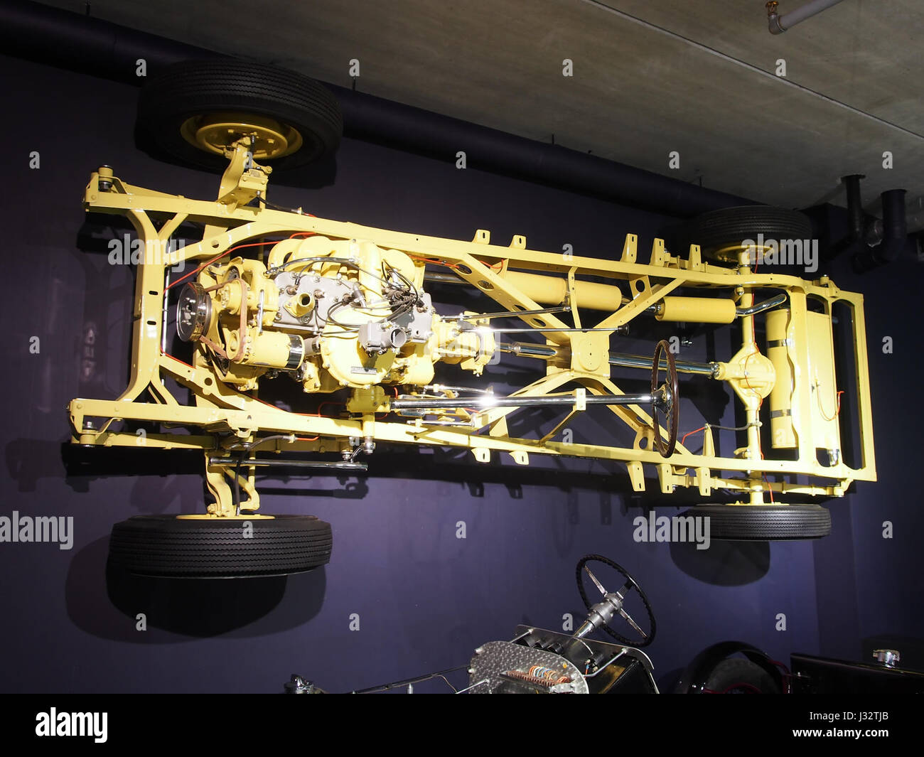 This photo shows an engine room, possibly in a ship or industrial ...