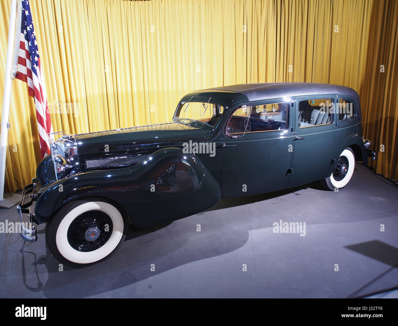This image captures a 1937 DC3BCsenberg Model J Limousine Landaulette ...