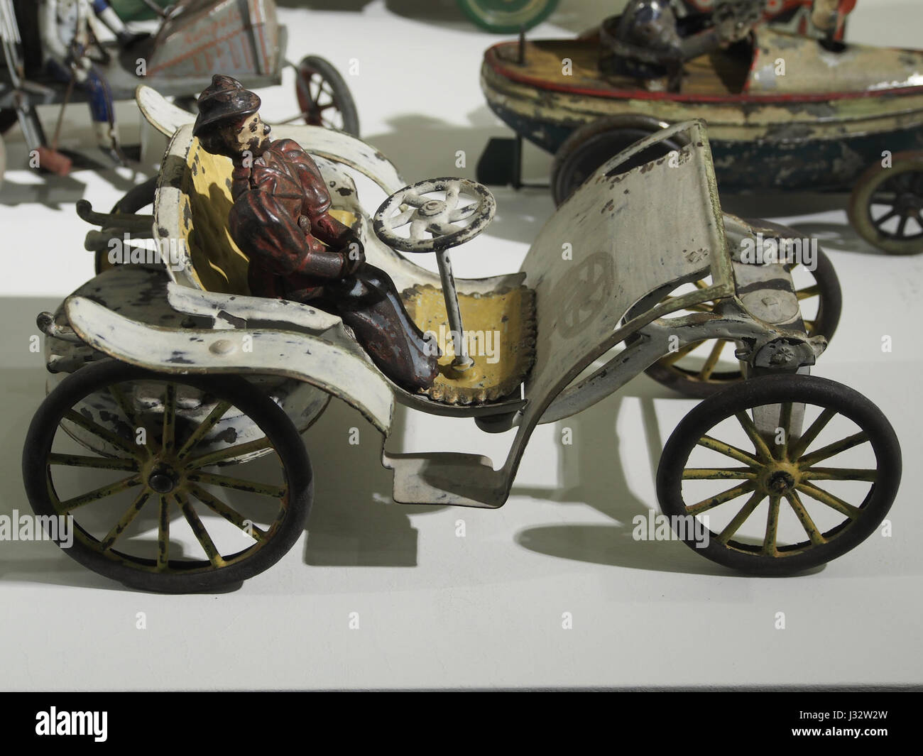 This photograph showcases a tin toy car on display in the Louwman ...